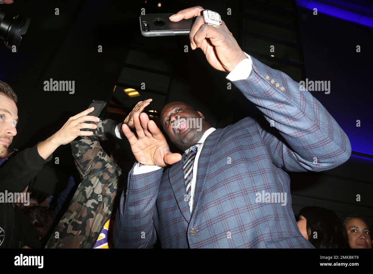 Shaquille O'Neal takes selfies with his fans as he arrives at the Grand ...