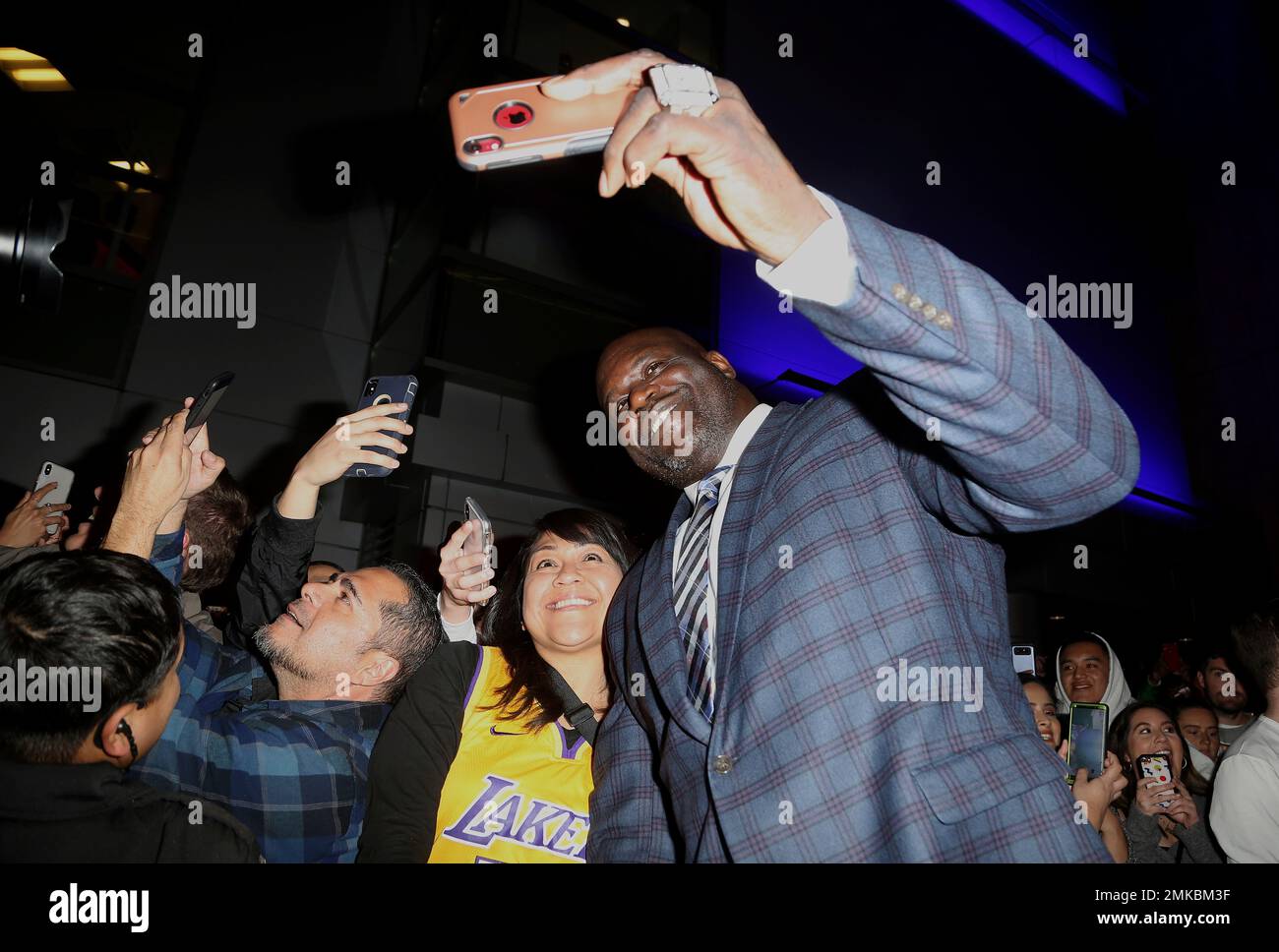 Shaquille O'Neal takes selfies with his fans as he arrives at the Grand ...