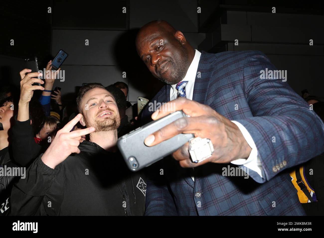 Shaquille O'Neal takes selfies with his fans as he arrives at the Grand ...