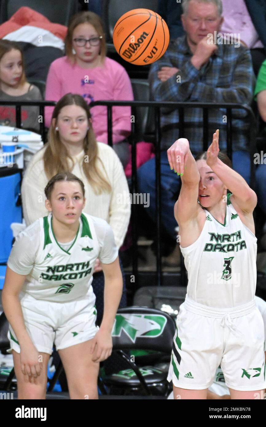 North Dakota Fighting Hawks guard Maggie Manson (3) shoots a three point shot while being ...