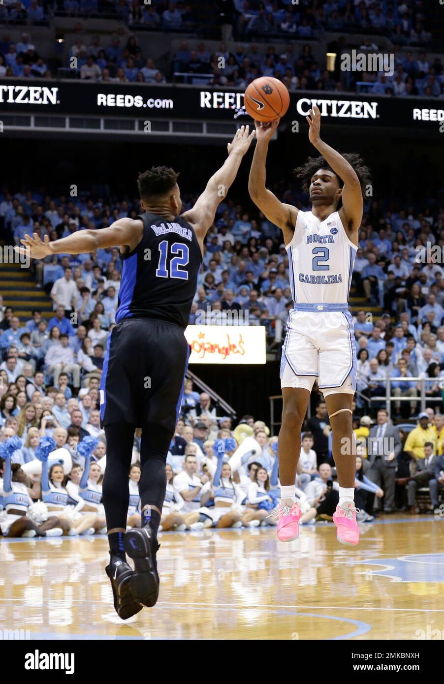 North Carolina's Coby White (2) shoots while Duke's Javin DeLaurier (12 ...