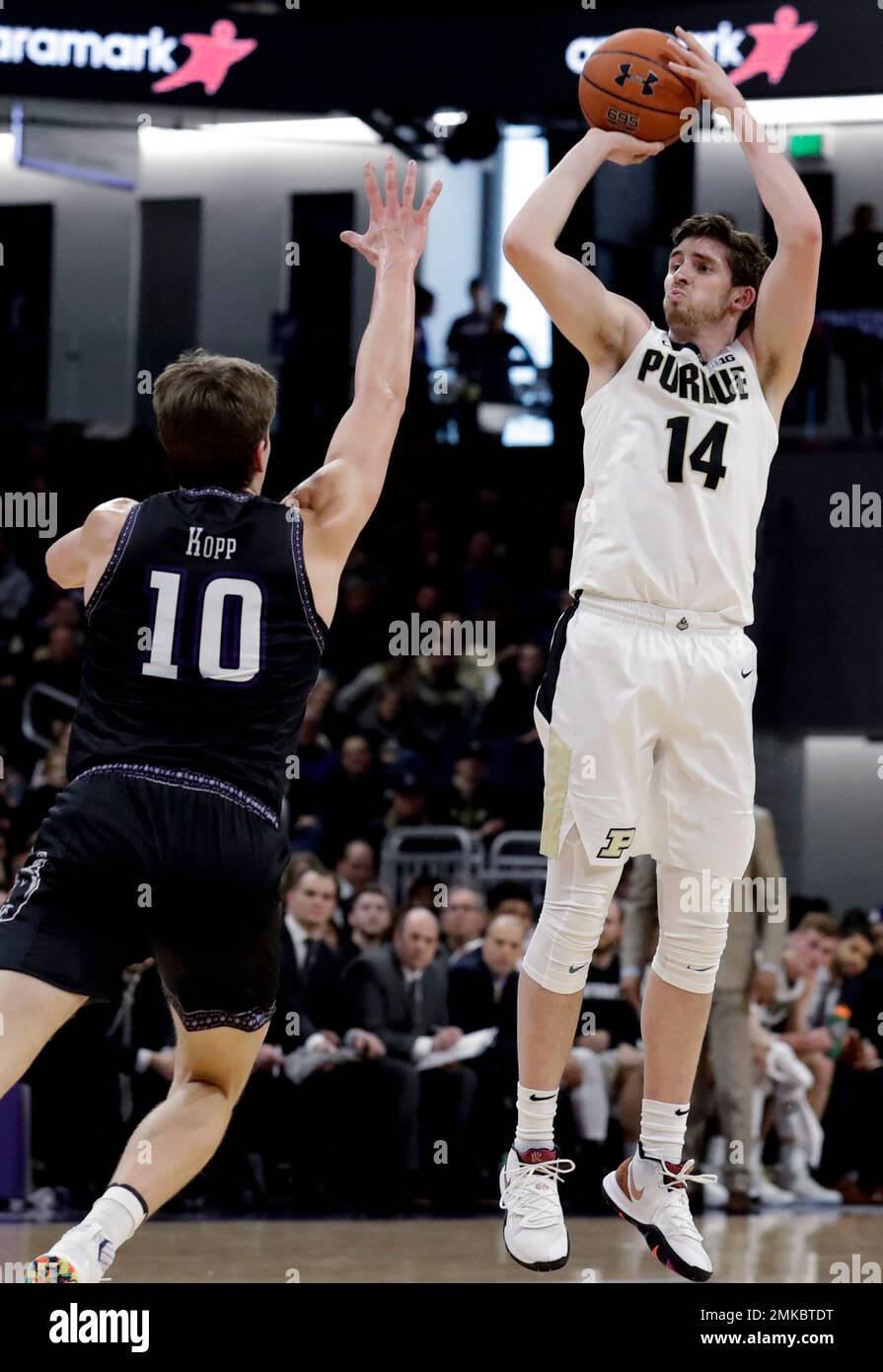 Purdue guard Ryan Cline, right, shoots against Northwestern forward ...