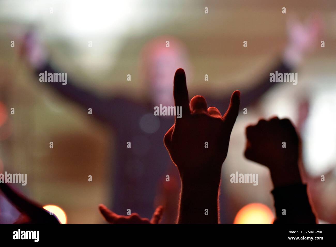 A general view of a concertgoers hand as David Draiman (rear) of the ...