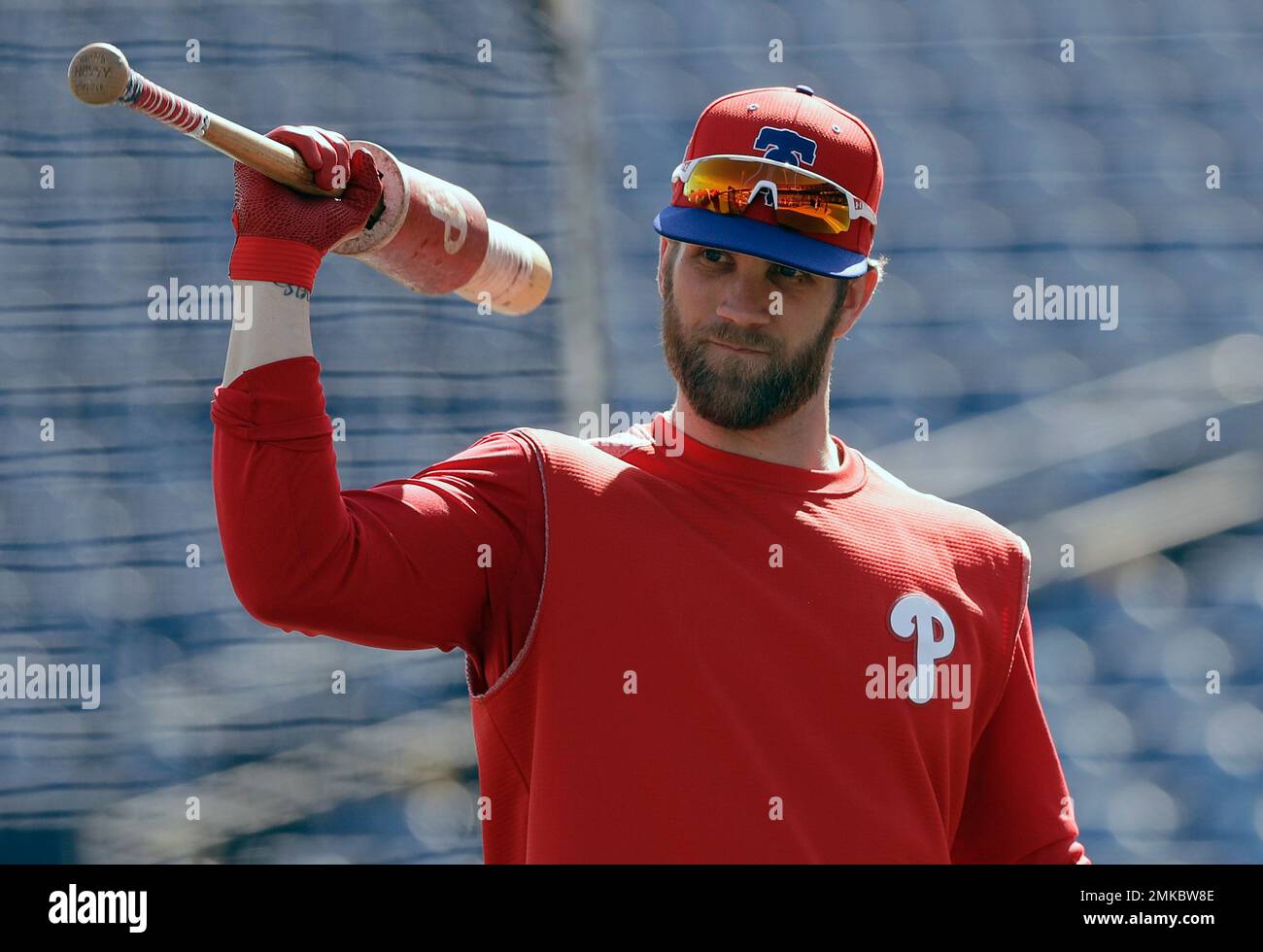 Philadelphia Phillies' Bryce Harper waits his turn in the batting cage ...