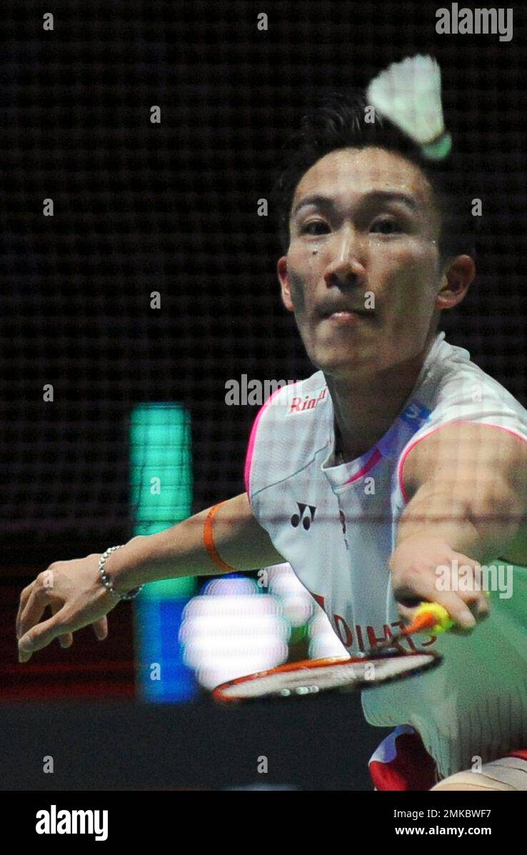 Japan's Kento Momota returns a shot during his semi final match against ...