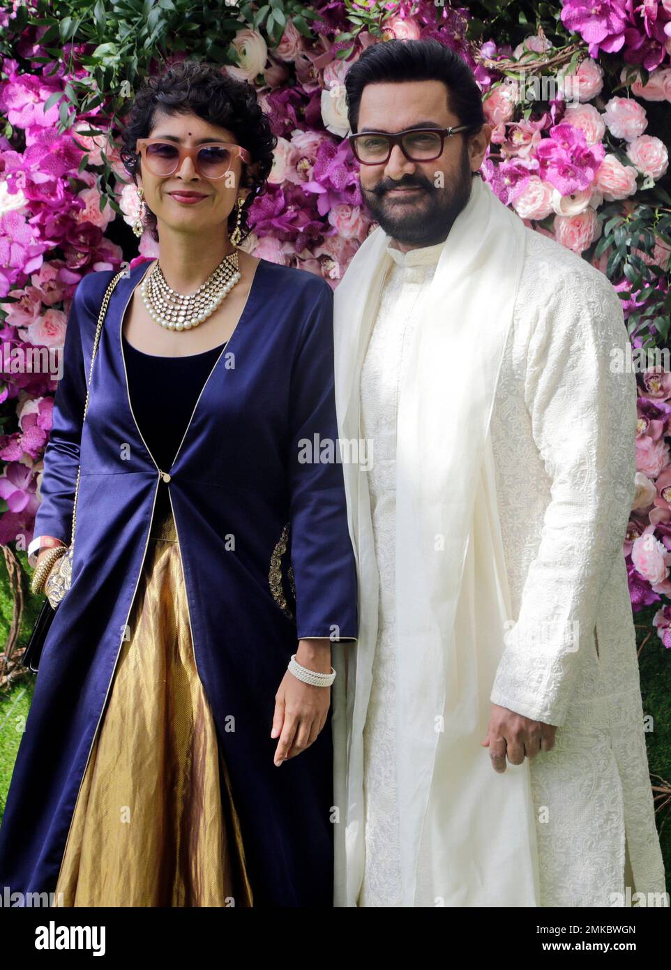 Bollywood actor Aamir Khan and wife Kiran Rao stand for photographs as ...