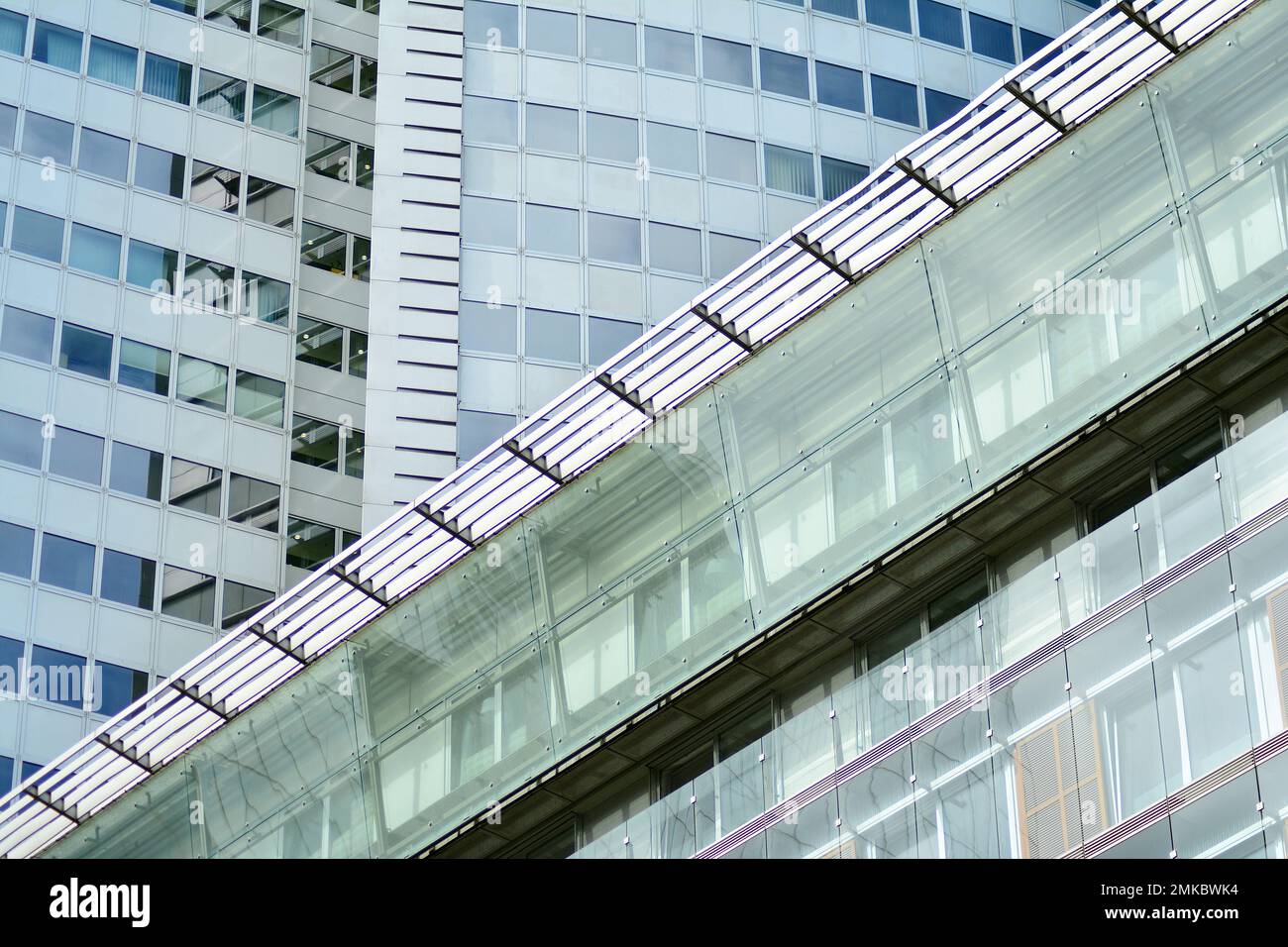 Abstract closeup of the glass-clad facade of a modern building covered ...