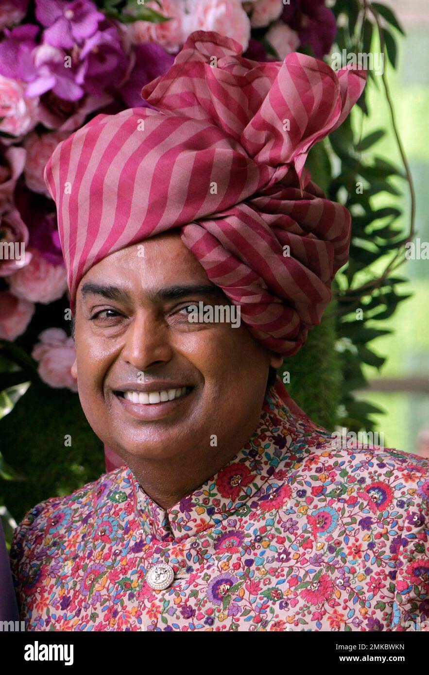Reliance Industries Chairman Mukesh Ambani stands for photographs with ...