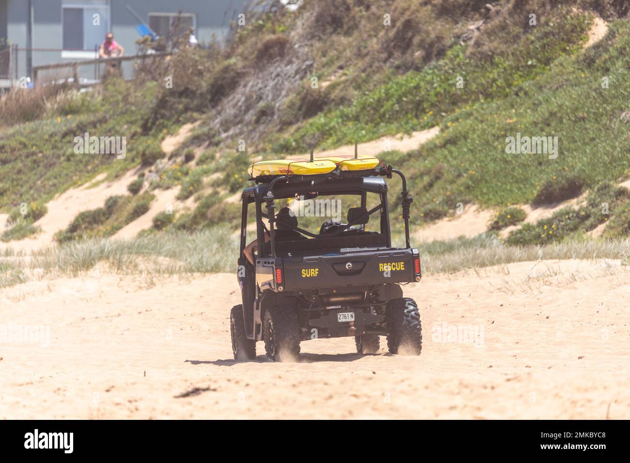 Australian surf rescue volunteer driving surf rescue beach buggy car ...