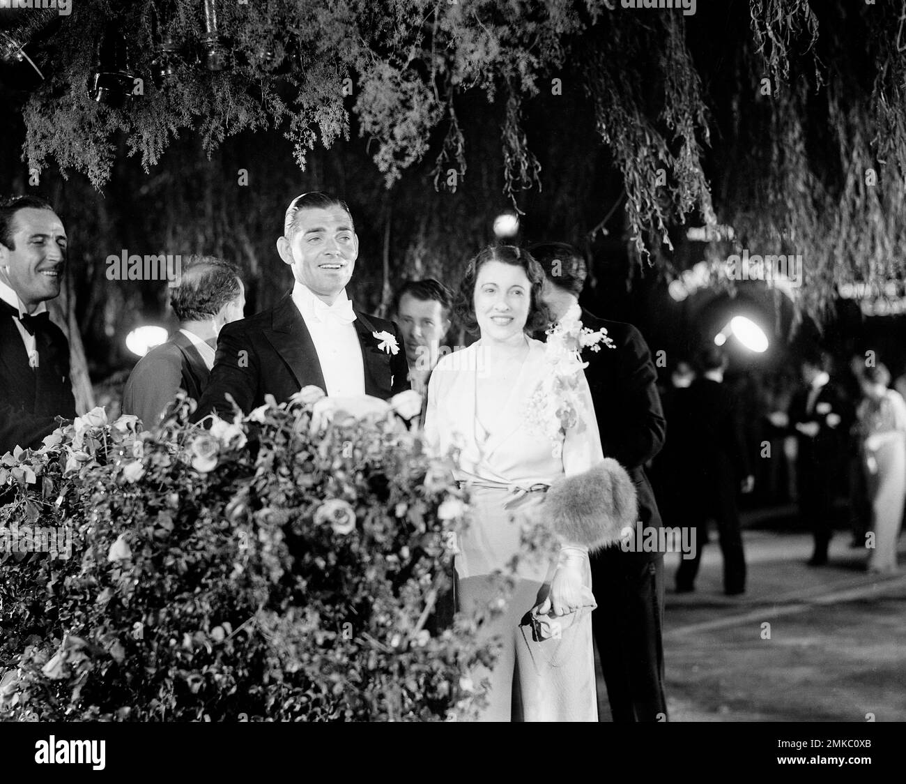Clark Gable and his wife Maria attend the opening of the film "Strange ...