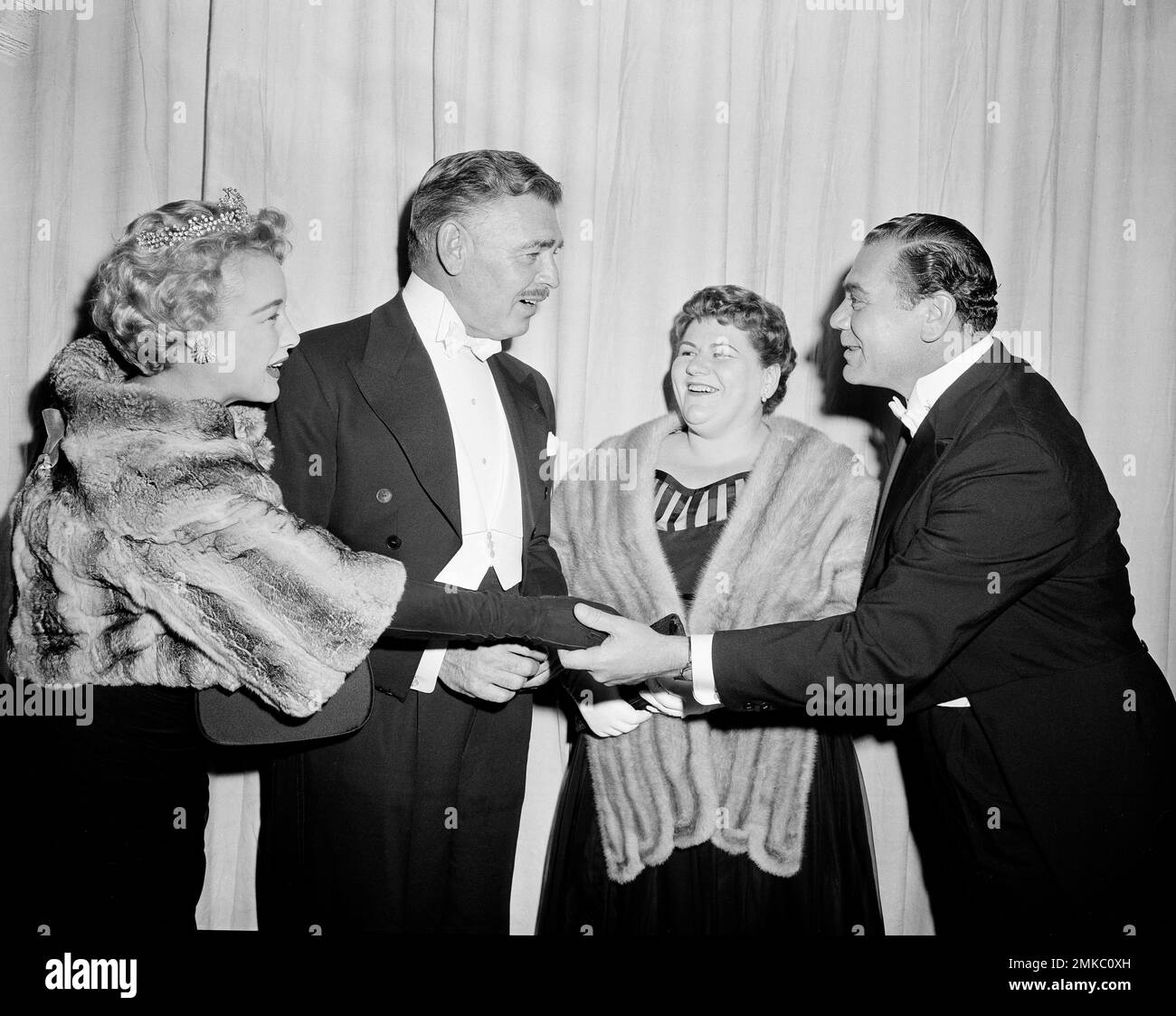 Clark Gable introduces his wife Kay Williams to Ernest Borgnine and his ...