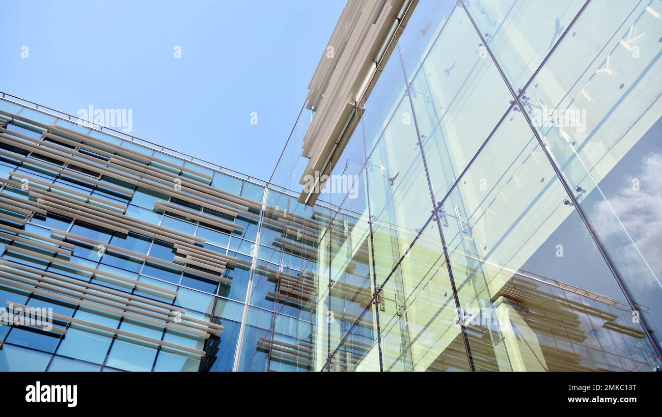Abstract closeup of the glass-clad facade of a modern building covered ...