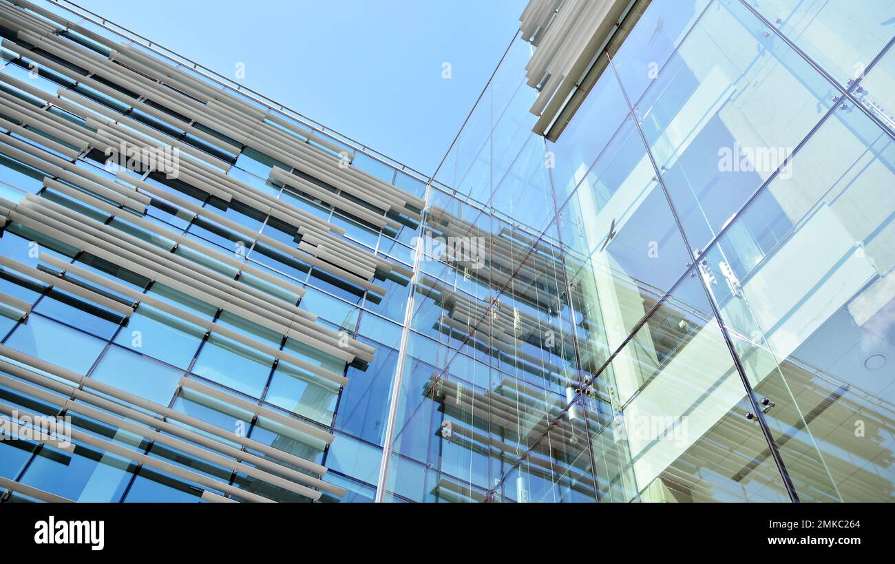 Abstract closeup of the glass-clad facade of a modern building covered ...
