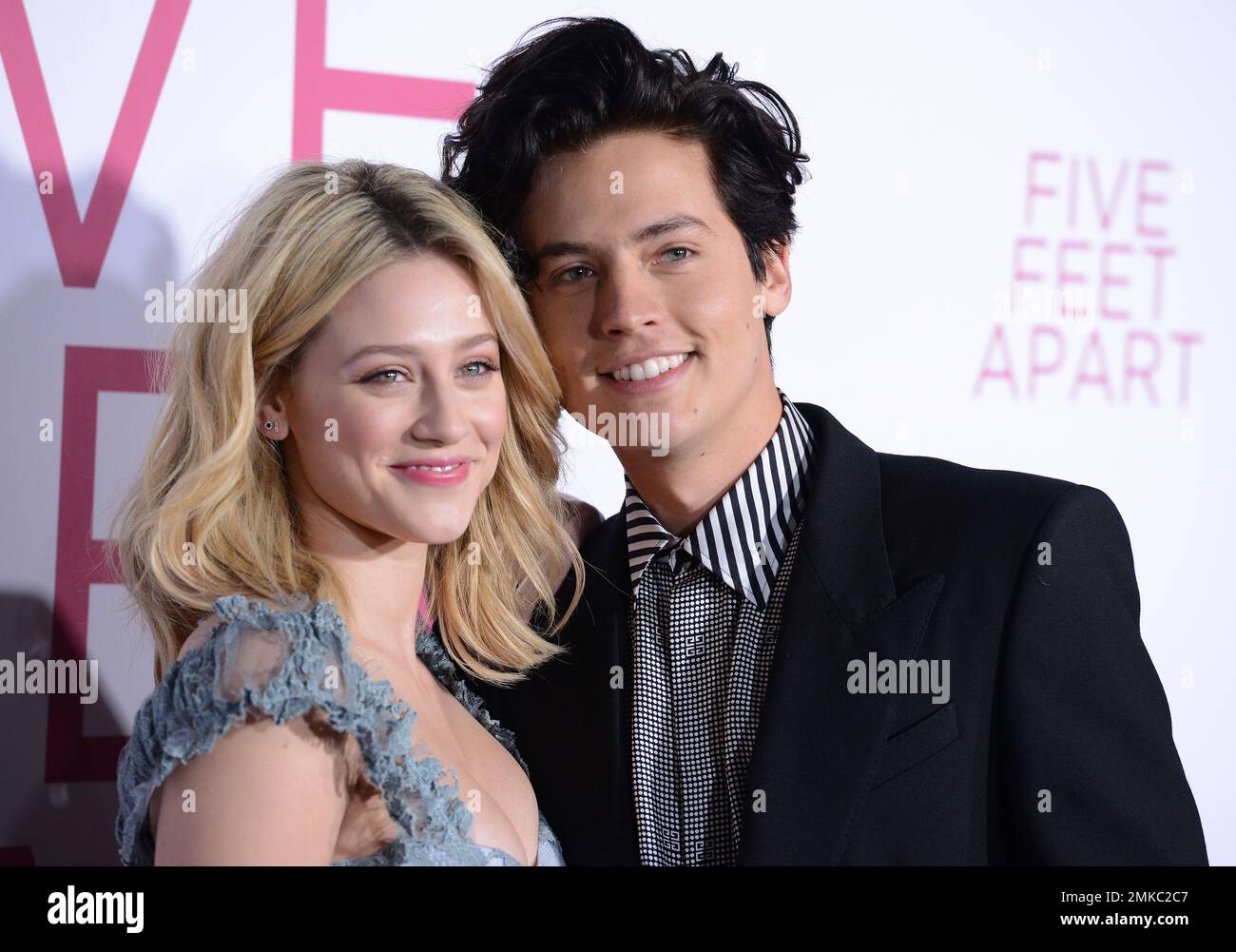 Lili Reinhart, left, and Cole Sprouse arrive at the Los Angeles ...