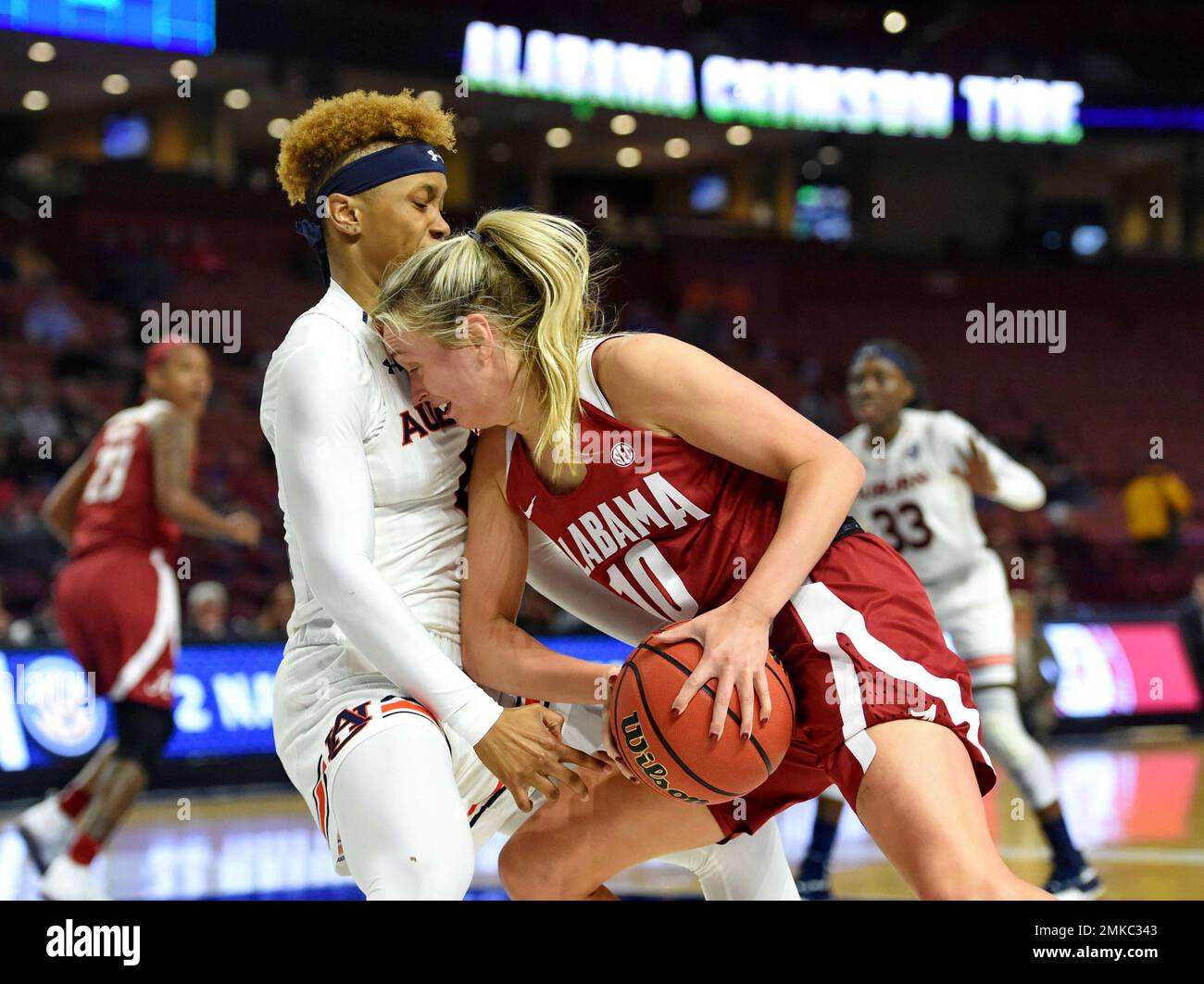 Alabama's Taylor Berry, right, drives against Auburn's Daisa Alexander ...