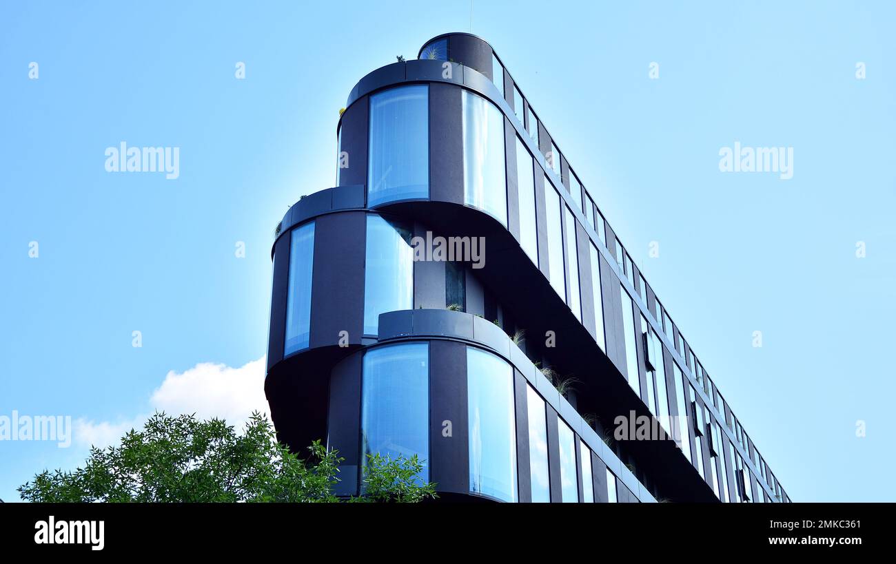 Abstract closeup of the glass-clad facade of a modern building covered ...