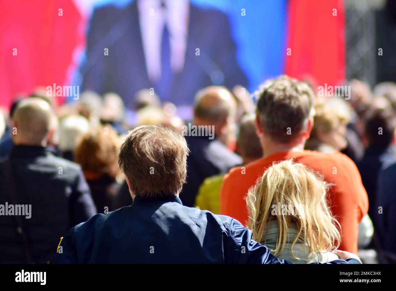 Crowd attending political meeting. Large group of people as audience to ...