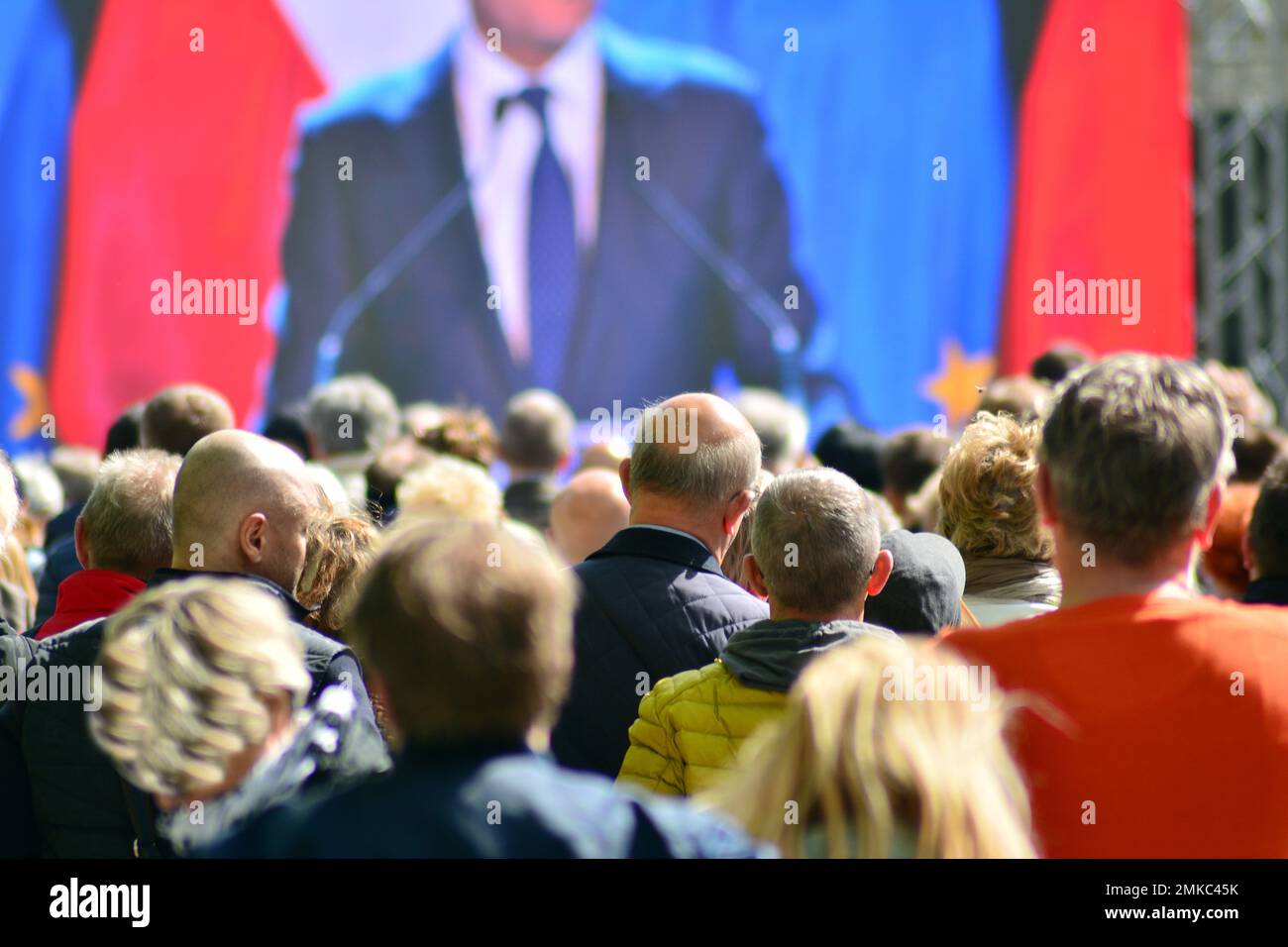 Crowd attending political meeting. Large group of people as audience to ...