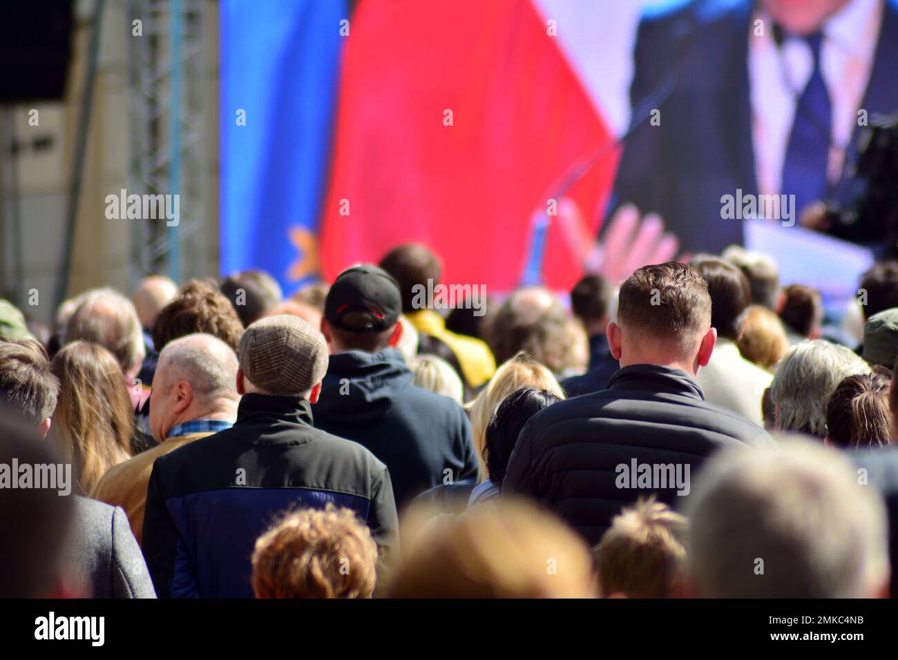 Crowd attending political meeting. Large group of people as audience to ...