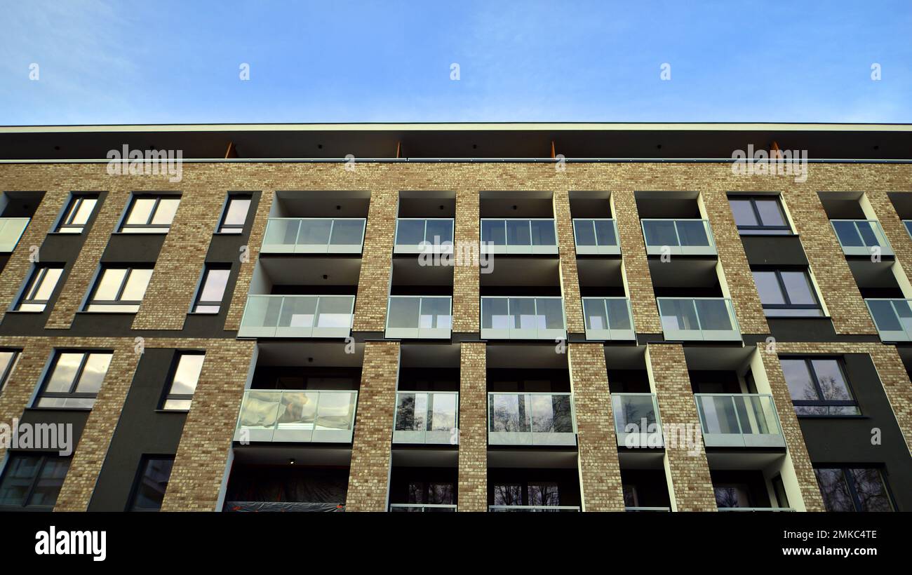 Condominium and apartment building with symmetrical modern architecture ...