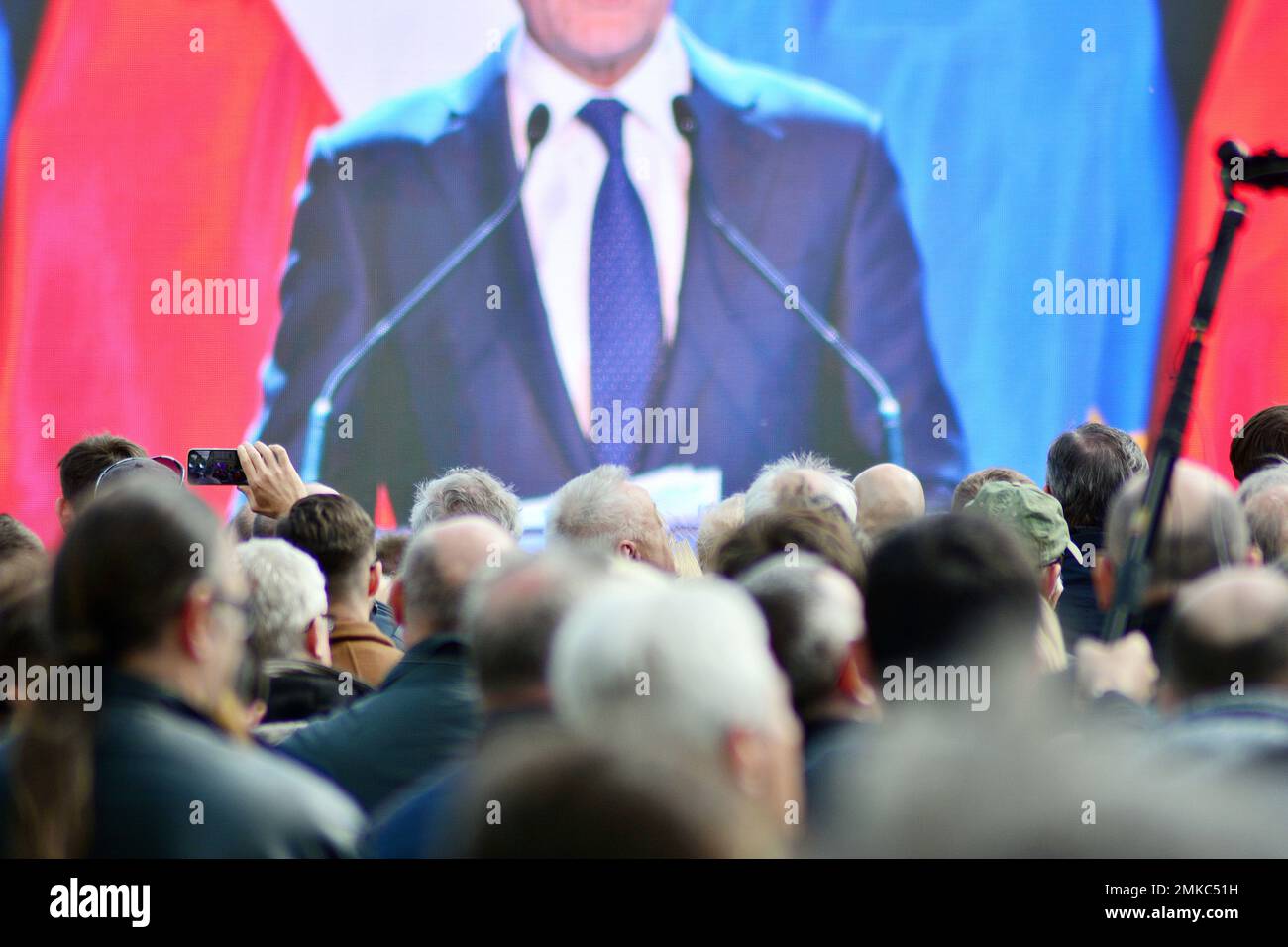 Crowd attending political meeting. Large group of people as audience to ...