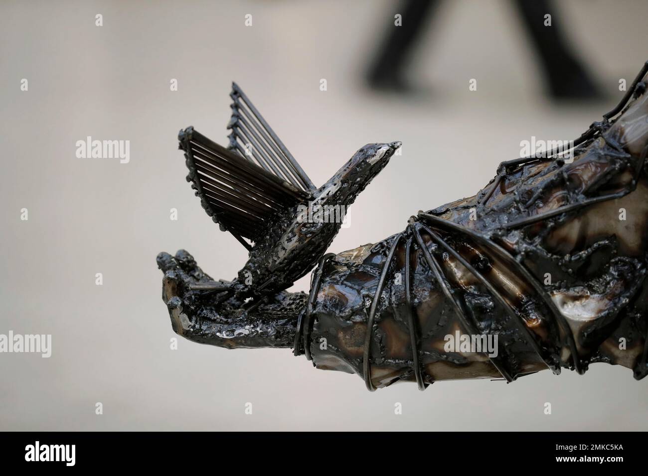 A detail of a dove being released is shown as a part of a sculpture ...