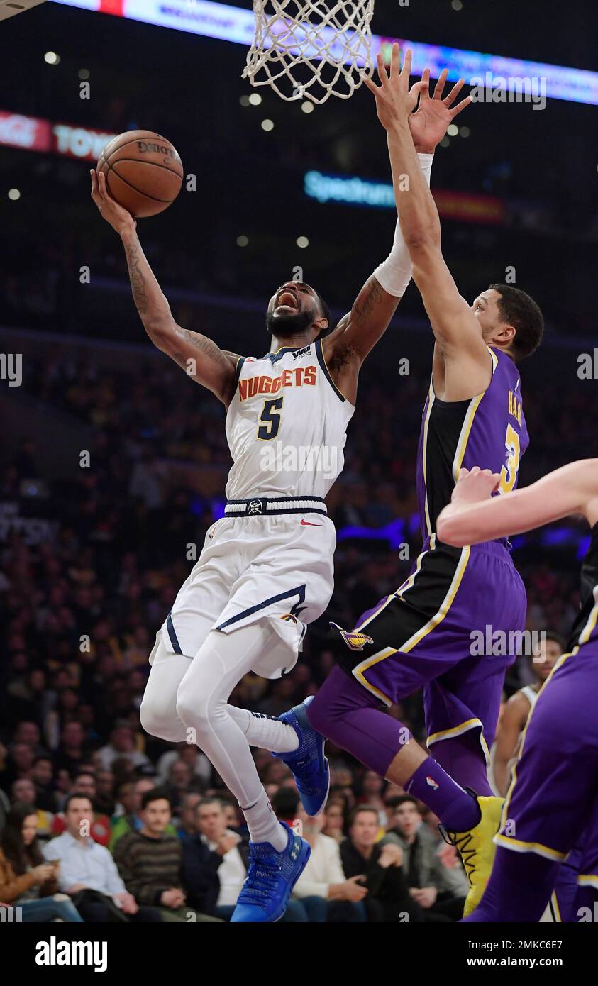 Denver Nuggets guard Will Barton, left, shoots as Los Angeles Lakers ...