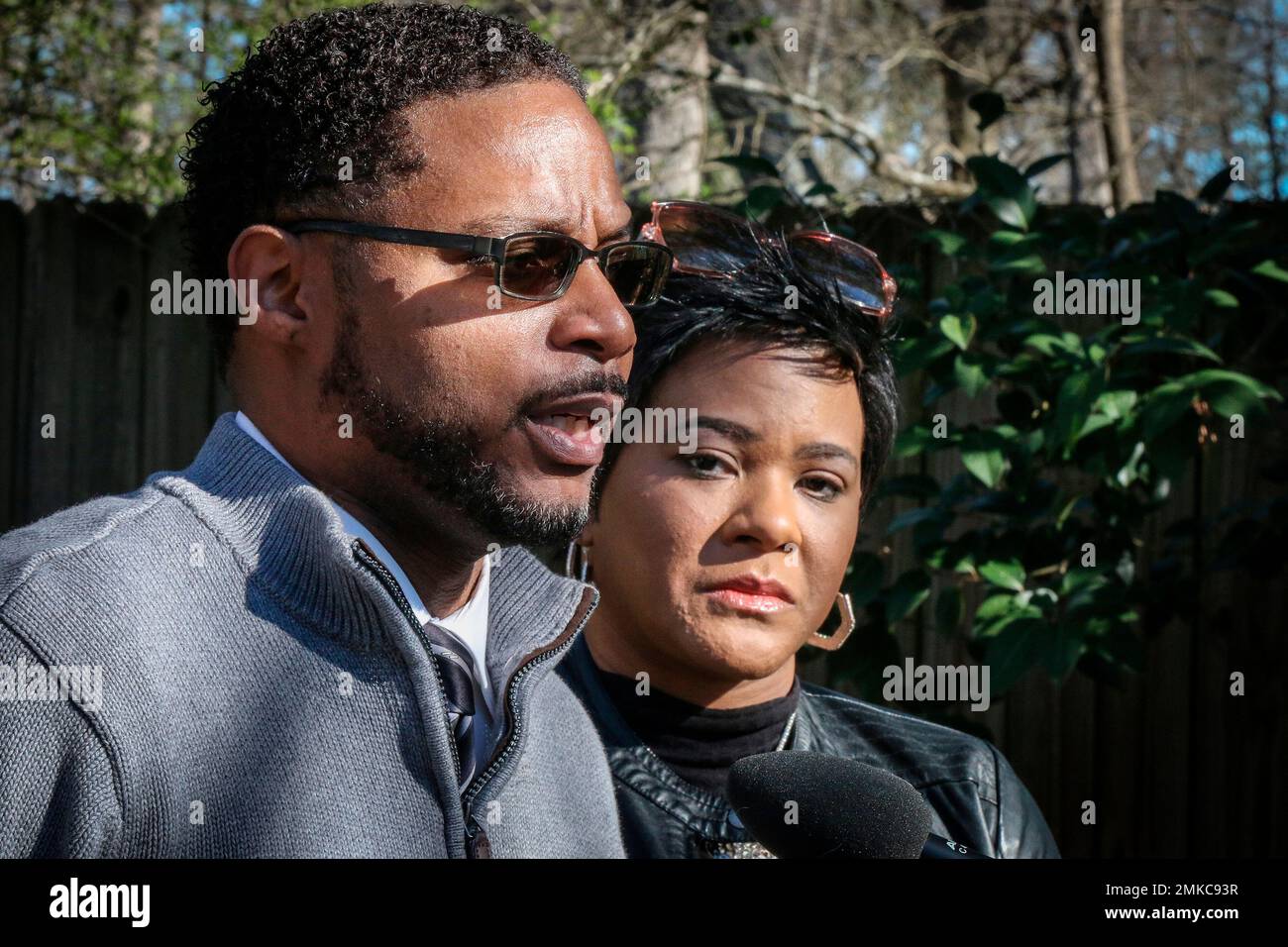 Timothy Savage, left, and his wife Jonjelyn Savage discuss their ...