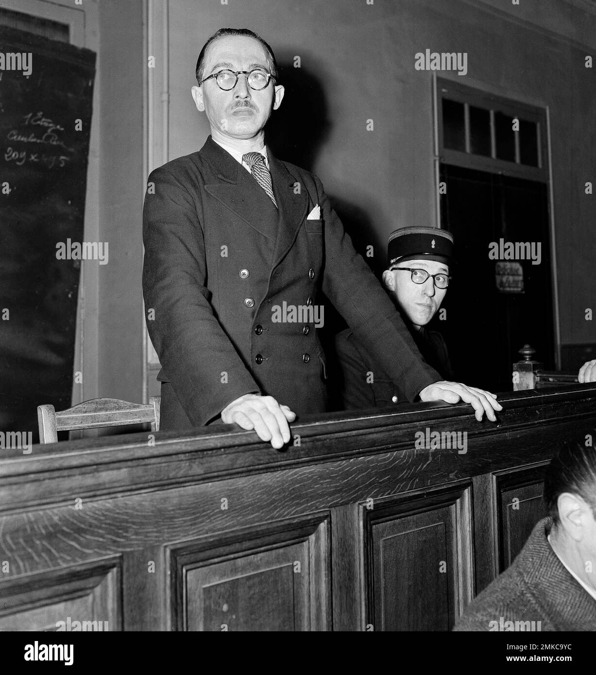 Karl Worlander, wartime officer in the German SS, appears before a ...