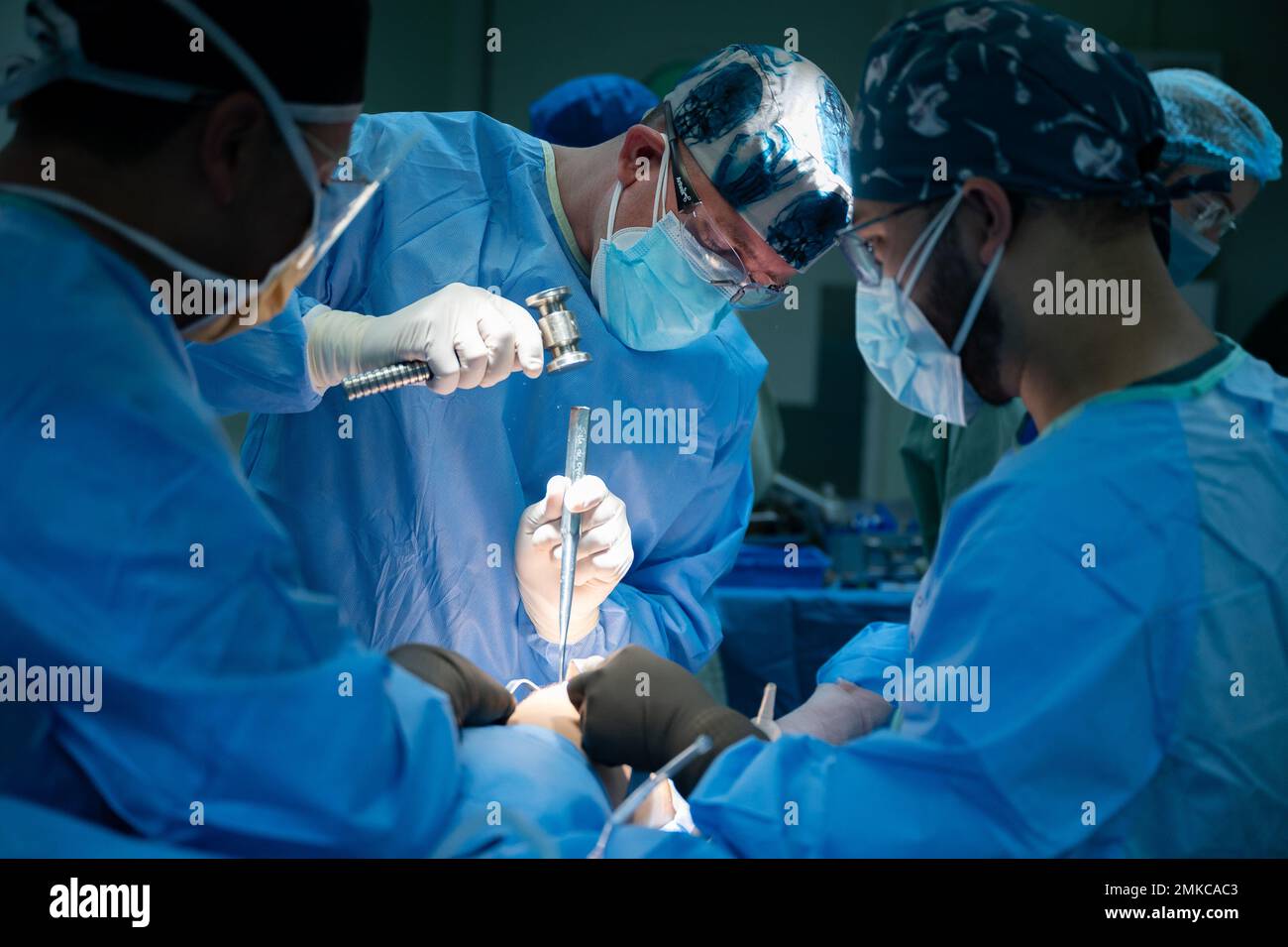 U.S. Air Force Lt. Col. Jacob Riis, center, an orthopedic surgeon ...