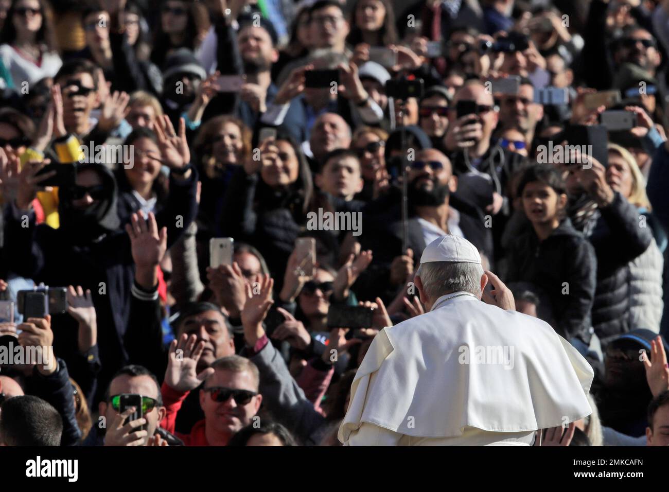 Pope Francis waves to faithful as he arrives in St. Peter's Square at ...
