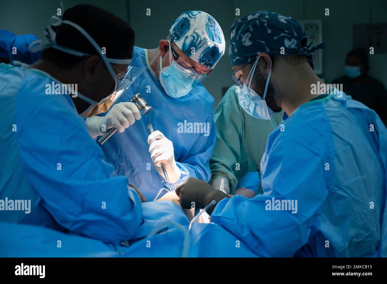 U.S. Air Force Lt. Col. Jacob Riis, center, an orthopedic surgeon ...