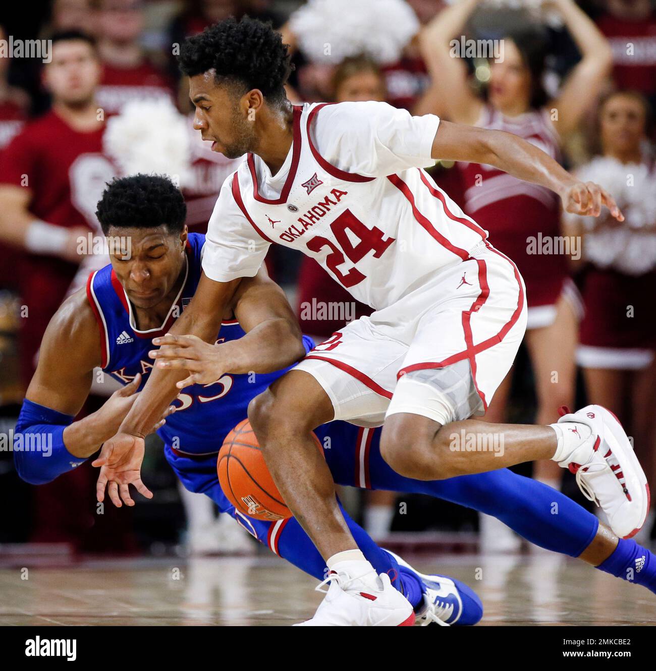 Kansas forward David McCormack (33) and Oklahoma guard Jamal Bieniemy ...