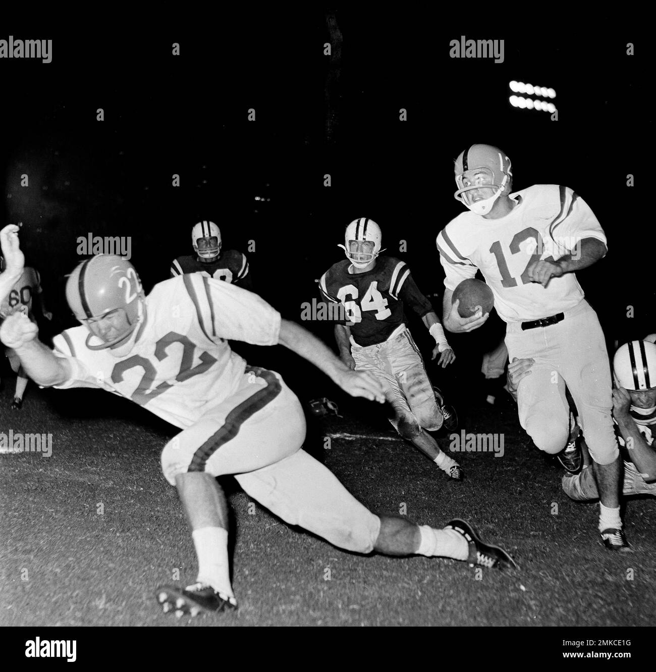 George Blair (22) of the University of Mississippi leads the way for ...