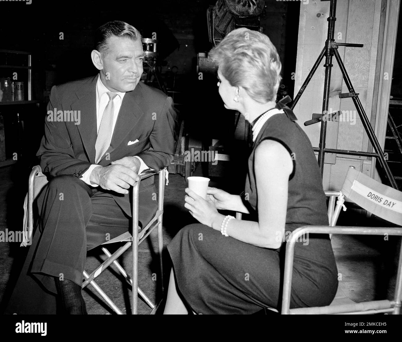 Clark Gable chats with Doris Day between shots for the film "Teacher's ...