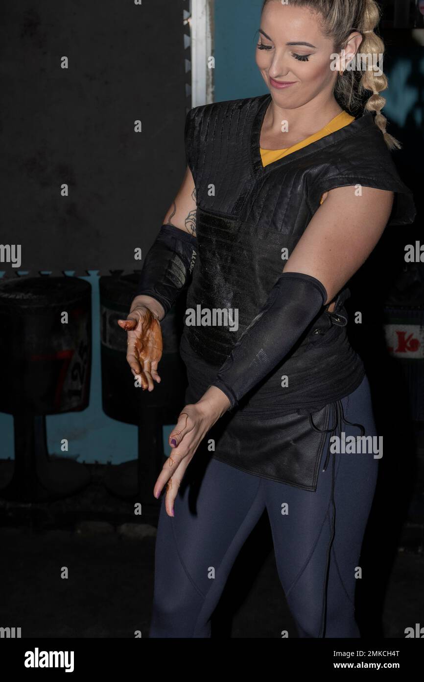 preparing to lift stones giving resian in her hands. rural athlete from ...