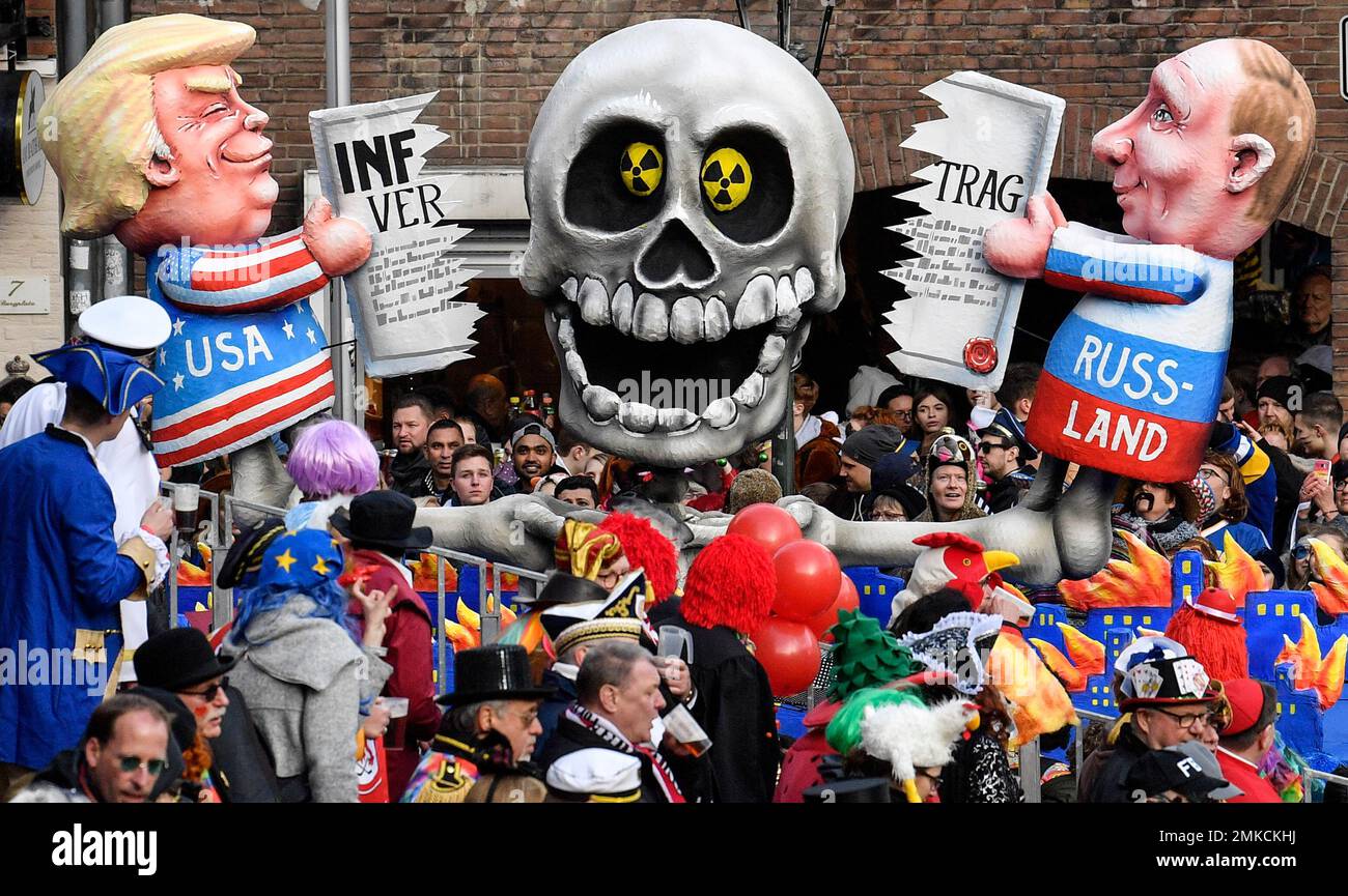A carnival float depicts Donald Trump and Vladimir Putin cutting the ...