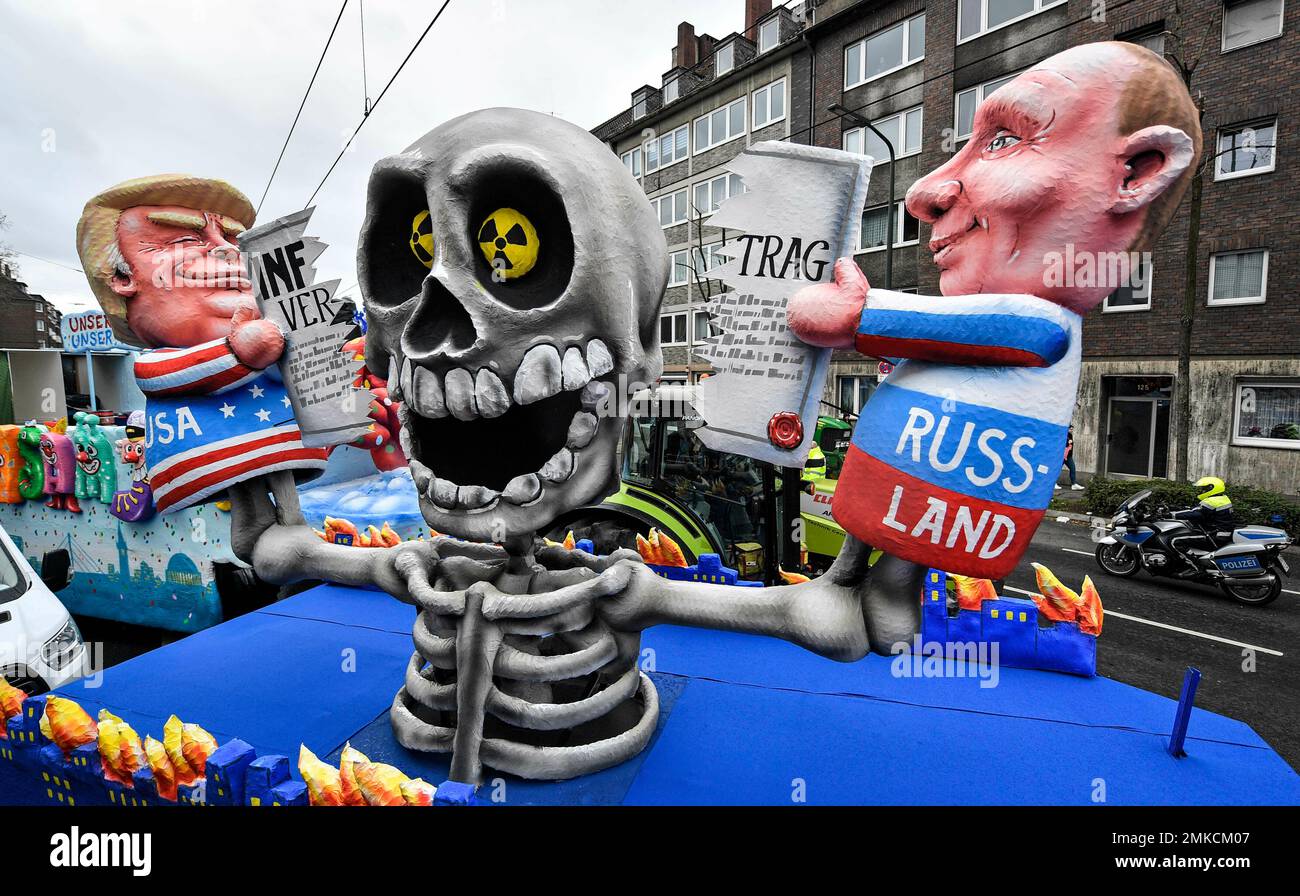A carnival float depicts Donald Trump and Vladimir Putin cutting the ...