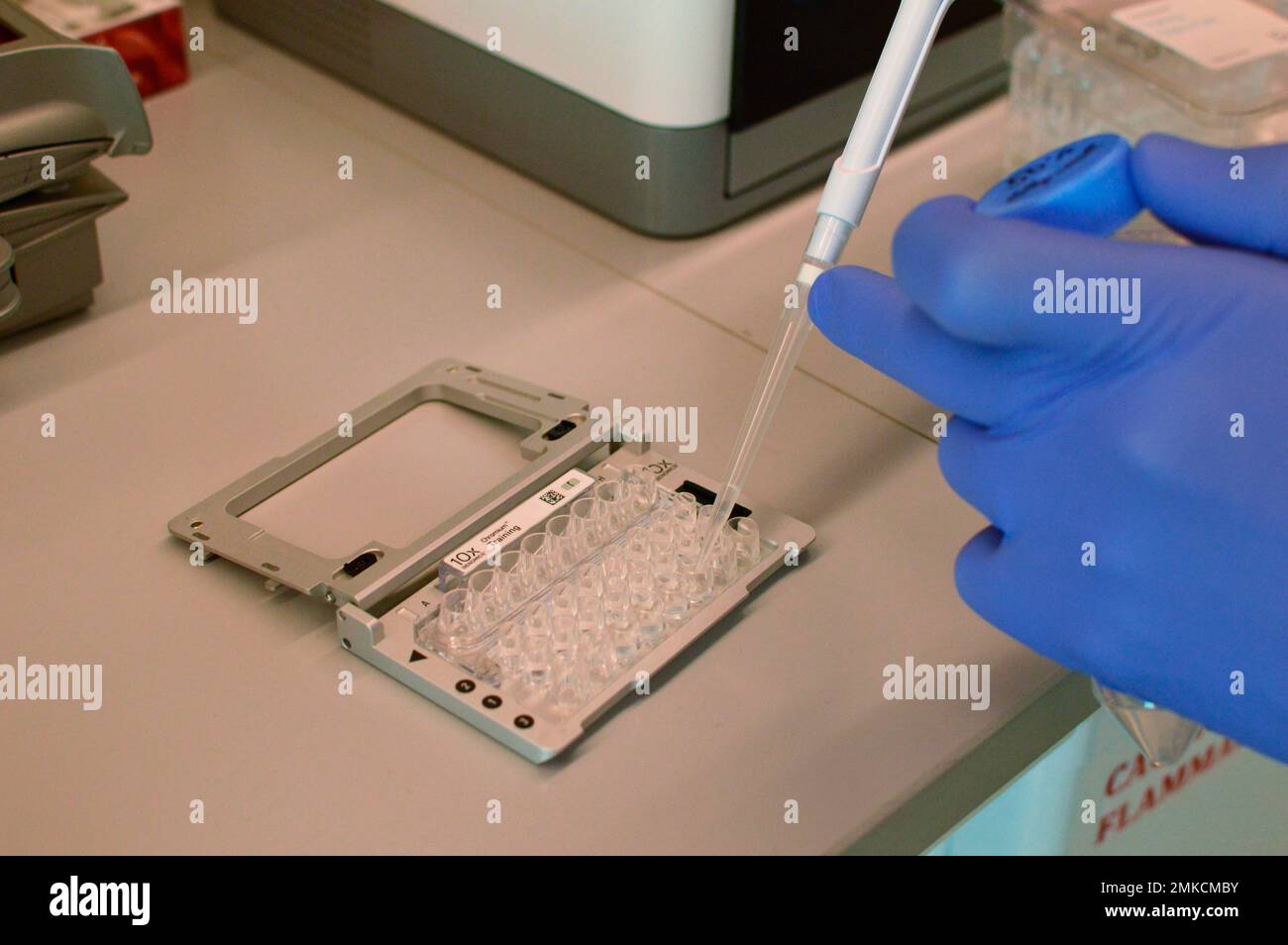 A scientist at the NY Genome Center in New York demonstrates equipment ...