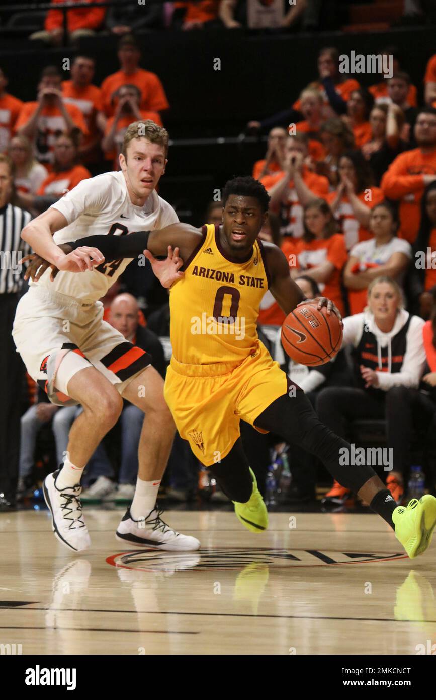 Arizona State's Luguentz Dort (0) drives to the basket, past Oregon ...