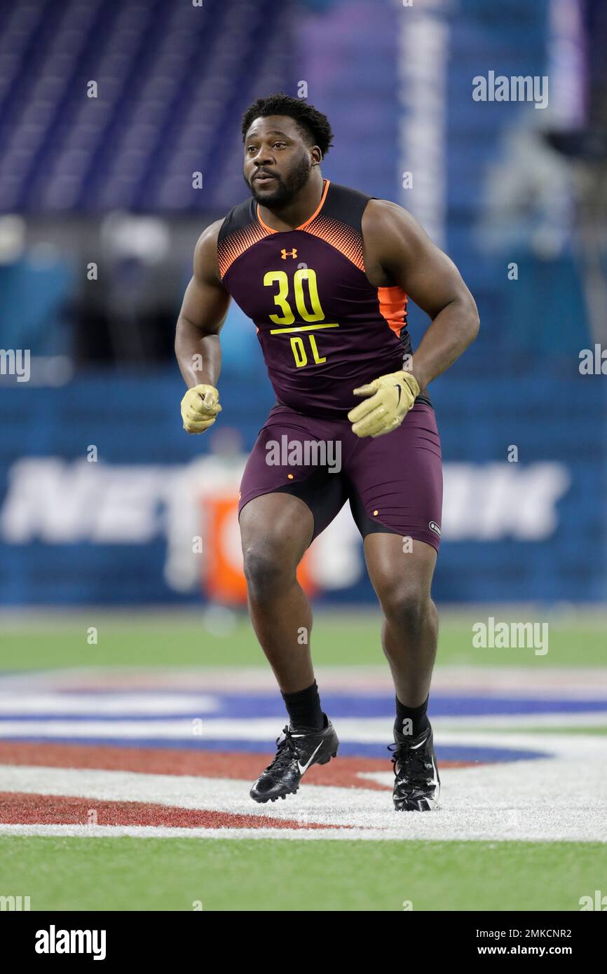 TCU defensive lineman L.J. Collier runs a drill during the NFL football ...