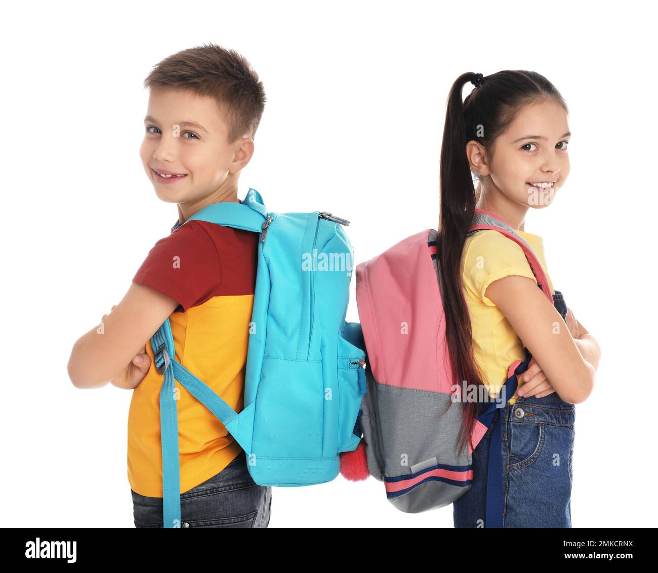 Little school children with backpacks on white background Stock Photo ...
