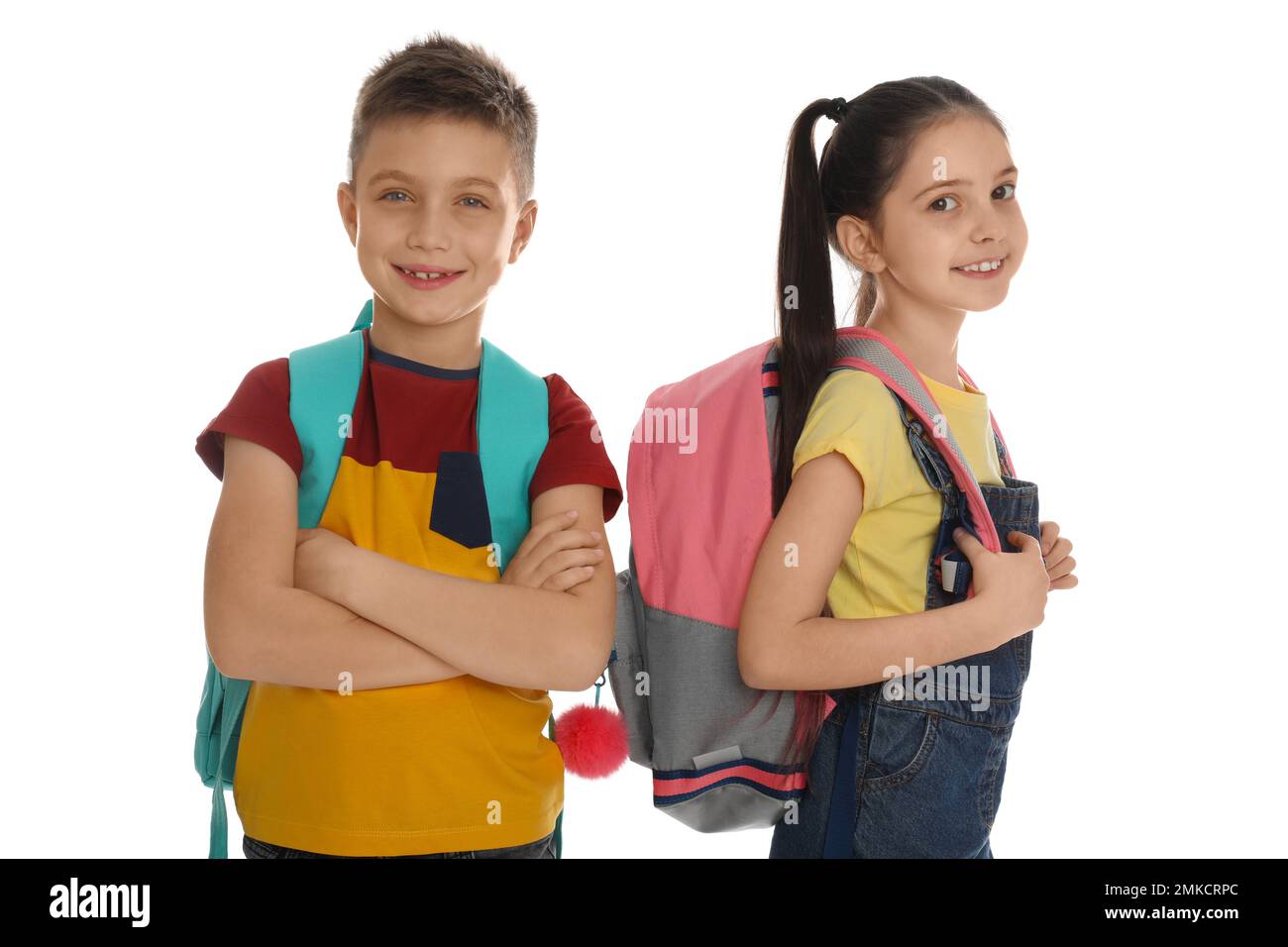 Little school children with backpacks on white background Stock Photo ...