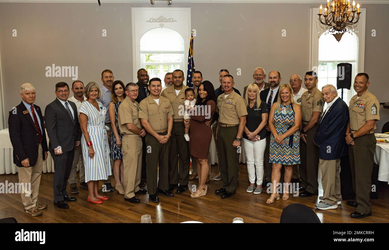 U.S. Marine Cpl. Austin Crooks (center), an administrative specialist ...
