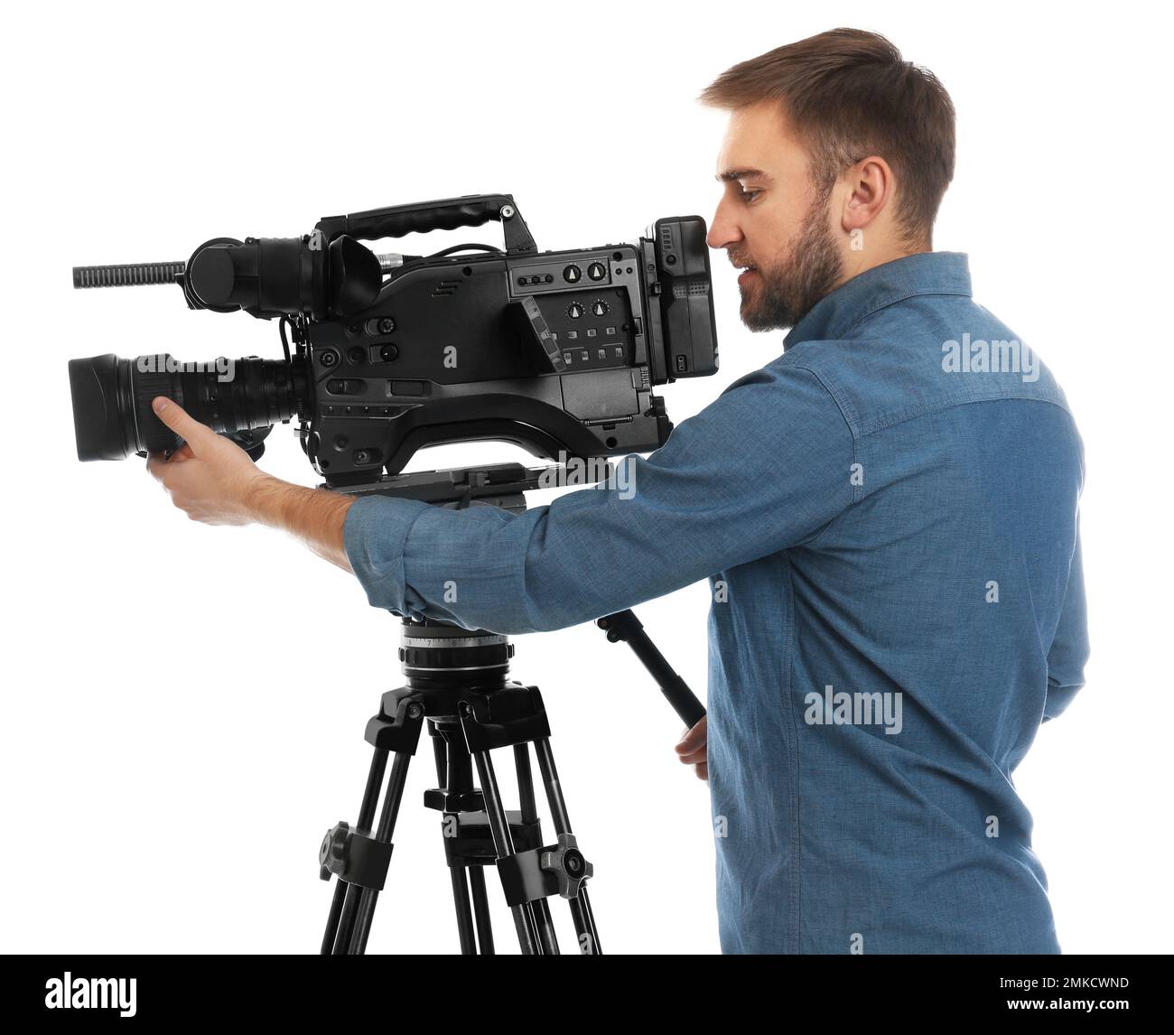 Operator with professional video camera on white background Stock Photo ...