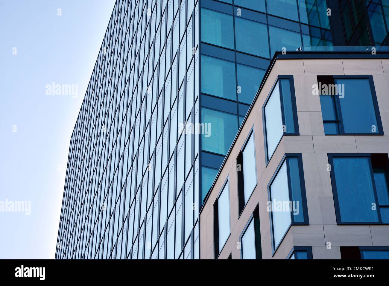 Abstract closeup of the glass-clad facade of a modern building covered ...