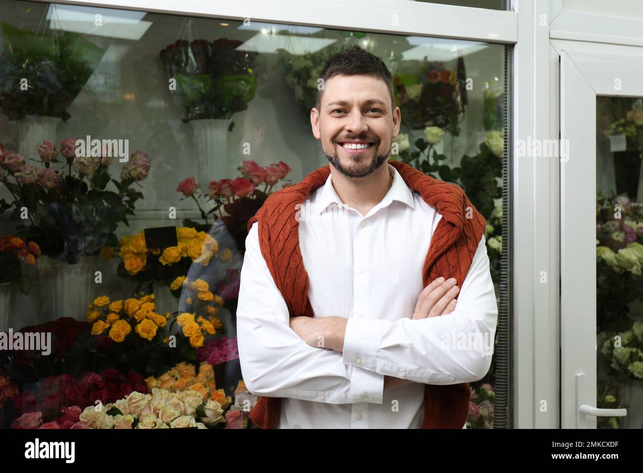 Happy florist standing arms hi-res stock photography and images - Alamy