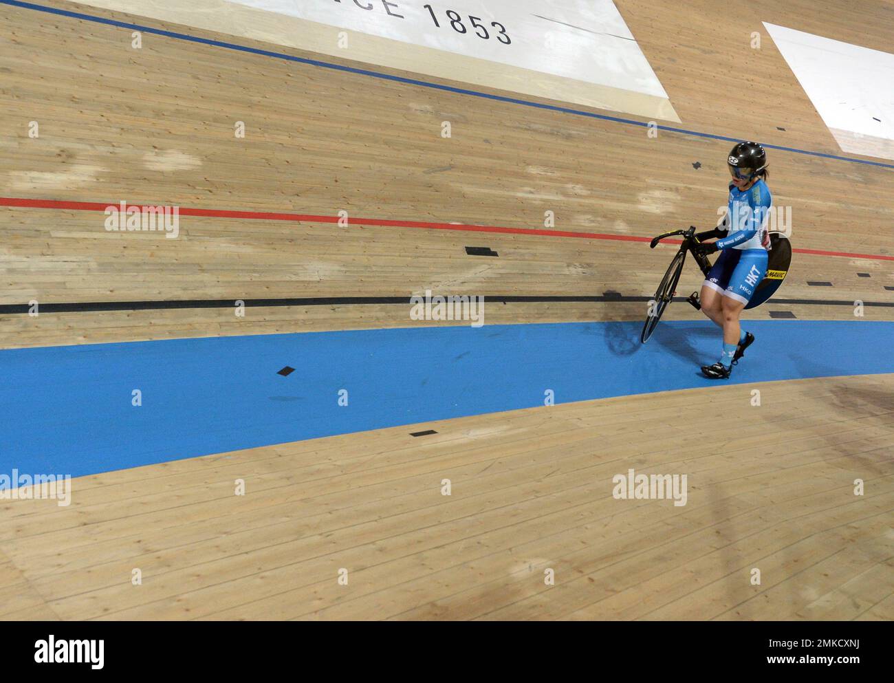 Hong Kong's Jessica Lee Hoi Yan carries her bicycle after crash in the ...