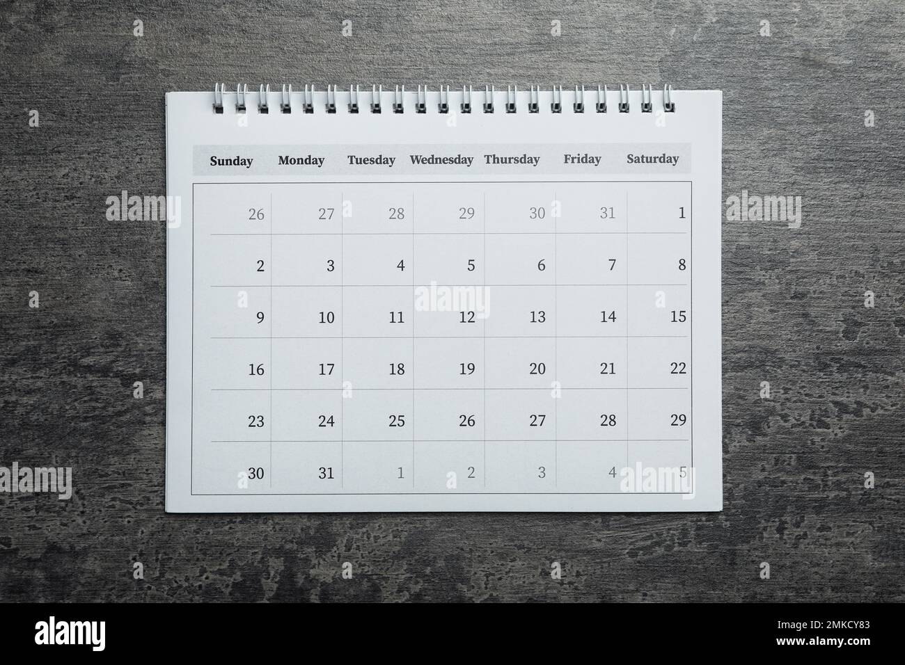 Paper calendar on grey stone background, top view Stock Photo - Alamy