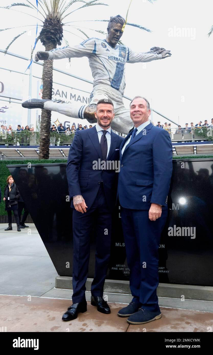 David Beckham, left, and Bruce Arena pose with the newly unveiled ...